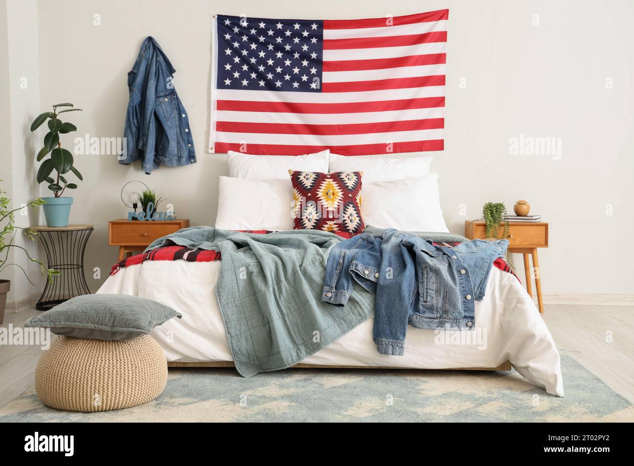 Interior of bedroom with USA flag and denim jackets Stock Photo - Alamy