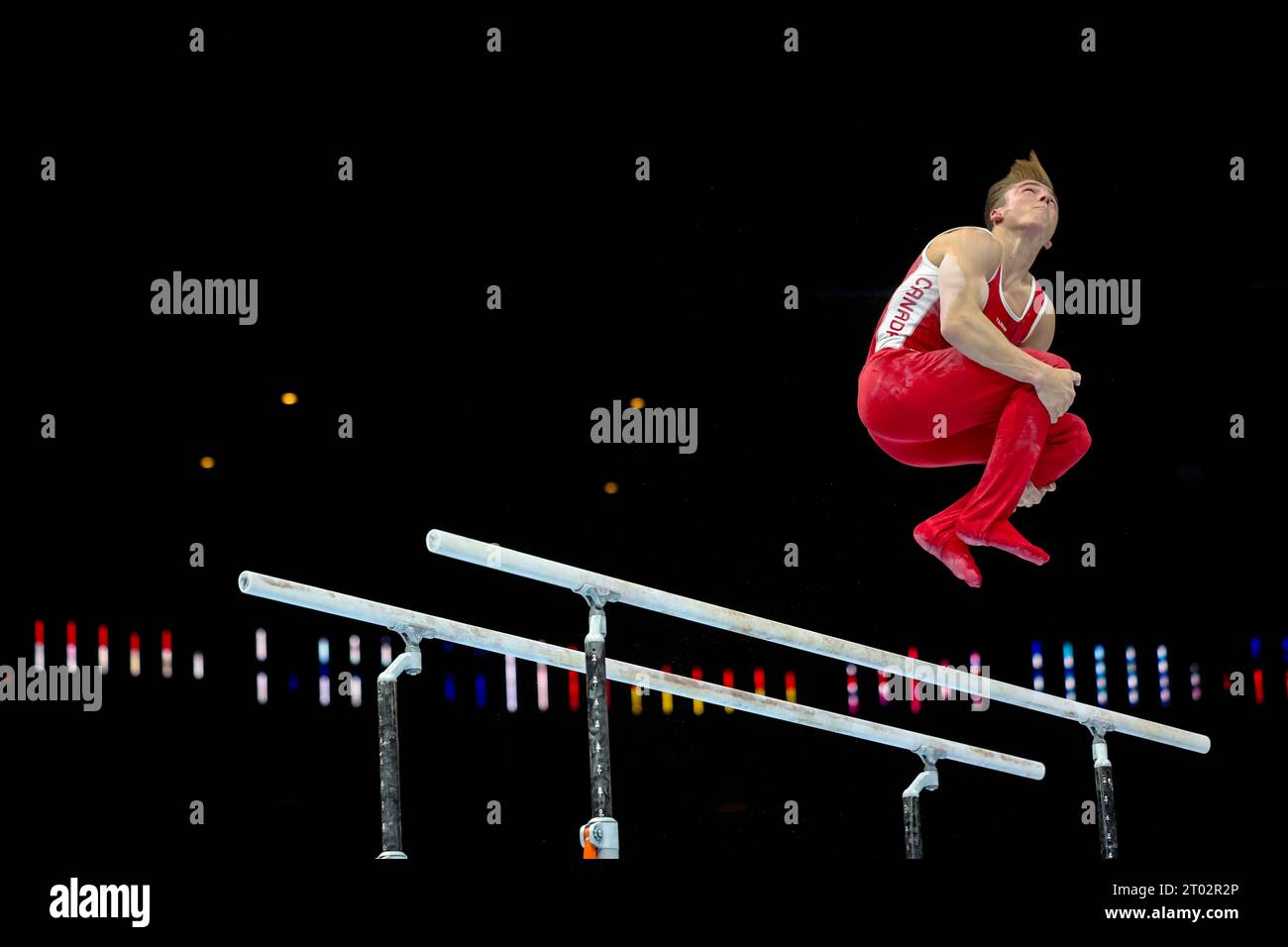 Canada's Felix Dolci competes on the parallel bars during the Men's ...