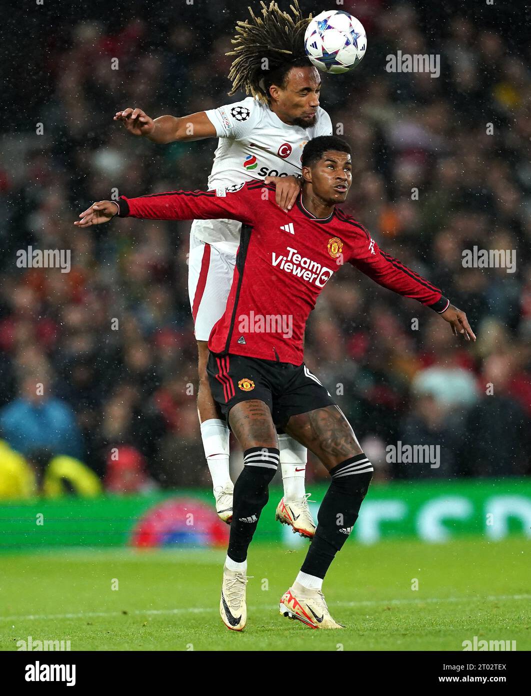 Manchester United's Marcus Rashford (right) and Galatasaray's Sacha Boey battle for the ball ...