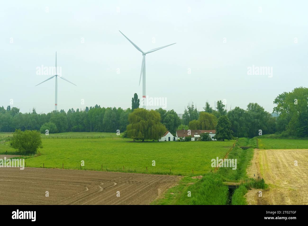 Wind turbines to generate electricity in plowed agricultural fields ...