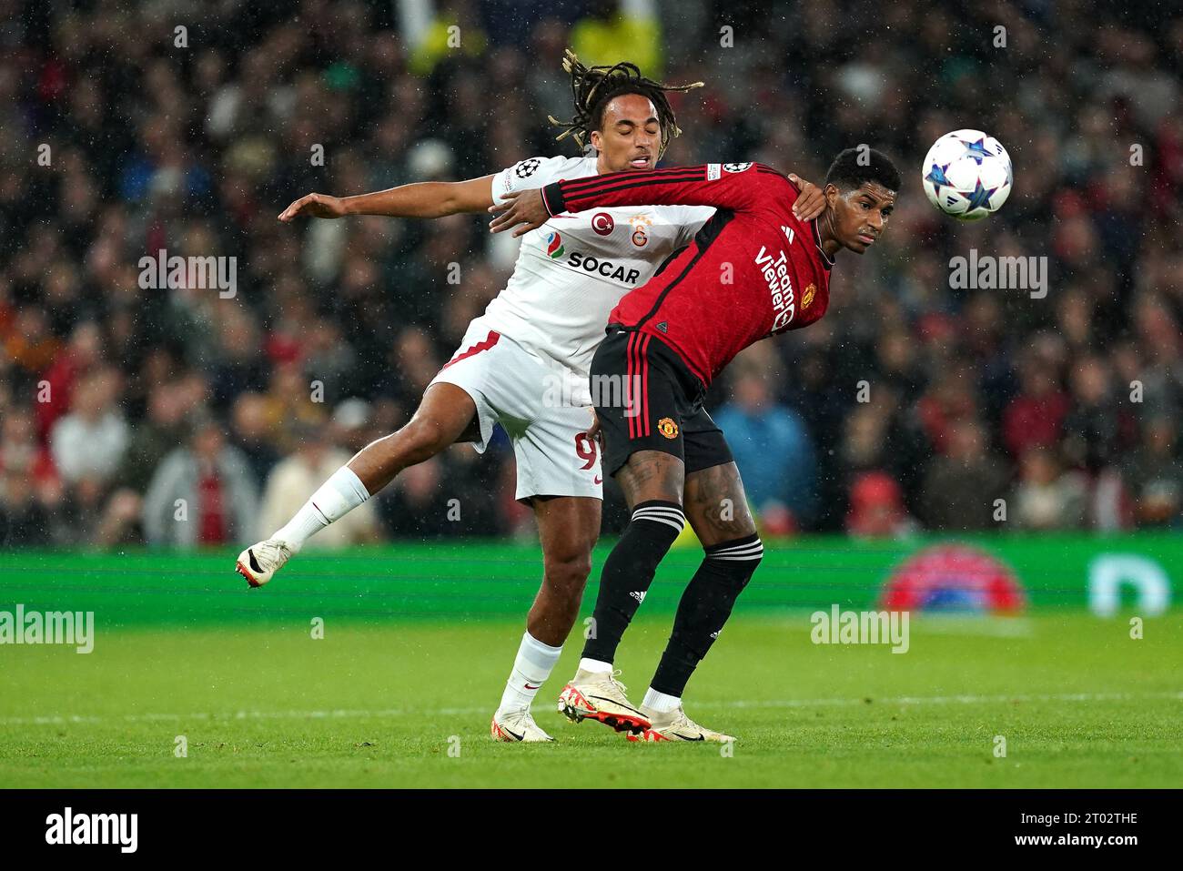 Manchester United's Marcus Rashford (right) and Galatasaray's Sacha Boey battle for the ball ...