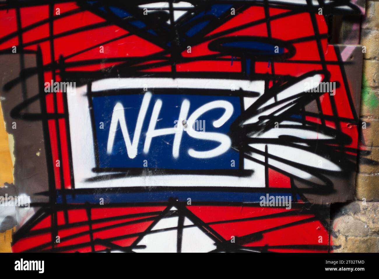 London, UK. 28th September, 2023. NHS graffiti on a wall in London ...
