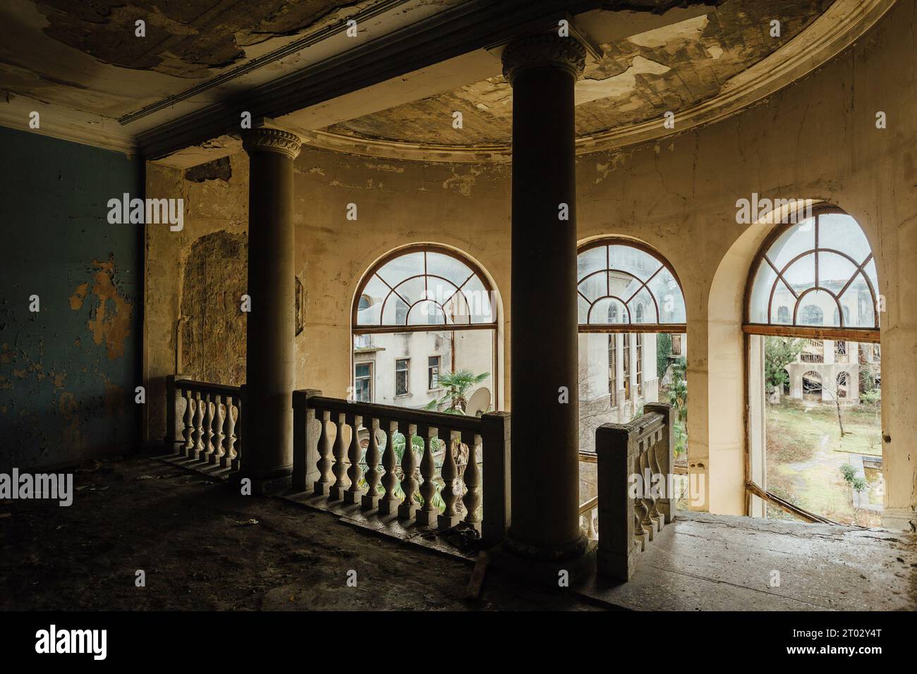 Large entrance hall with columns in old abandoned mansion, Sanatorium ...