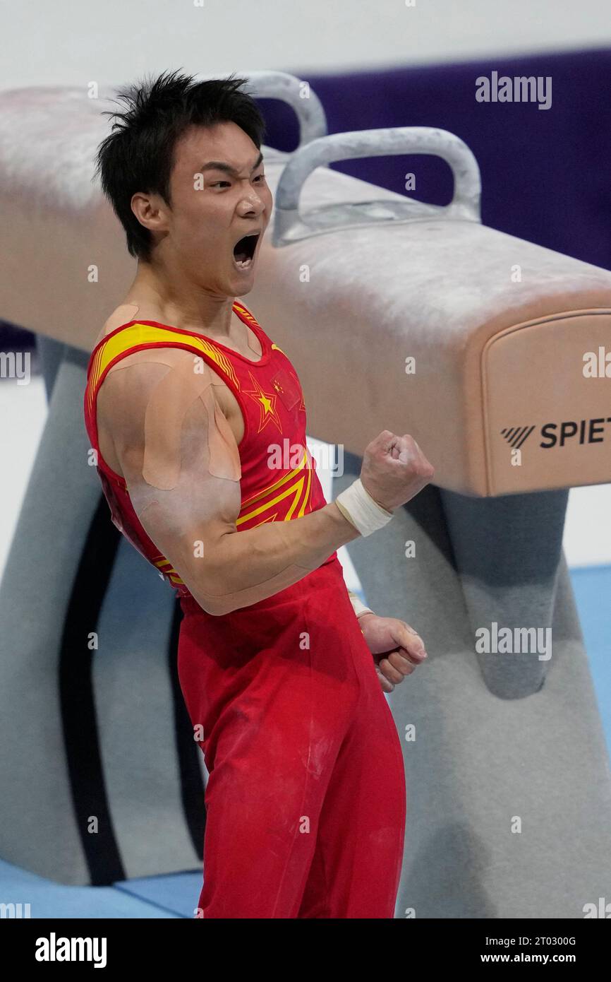 China's Sun Wei gestures as he competes on the pommel horse during the ...