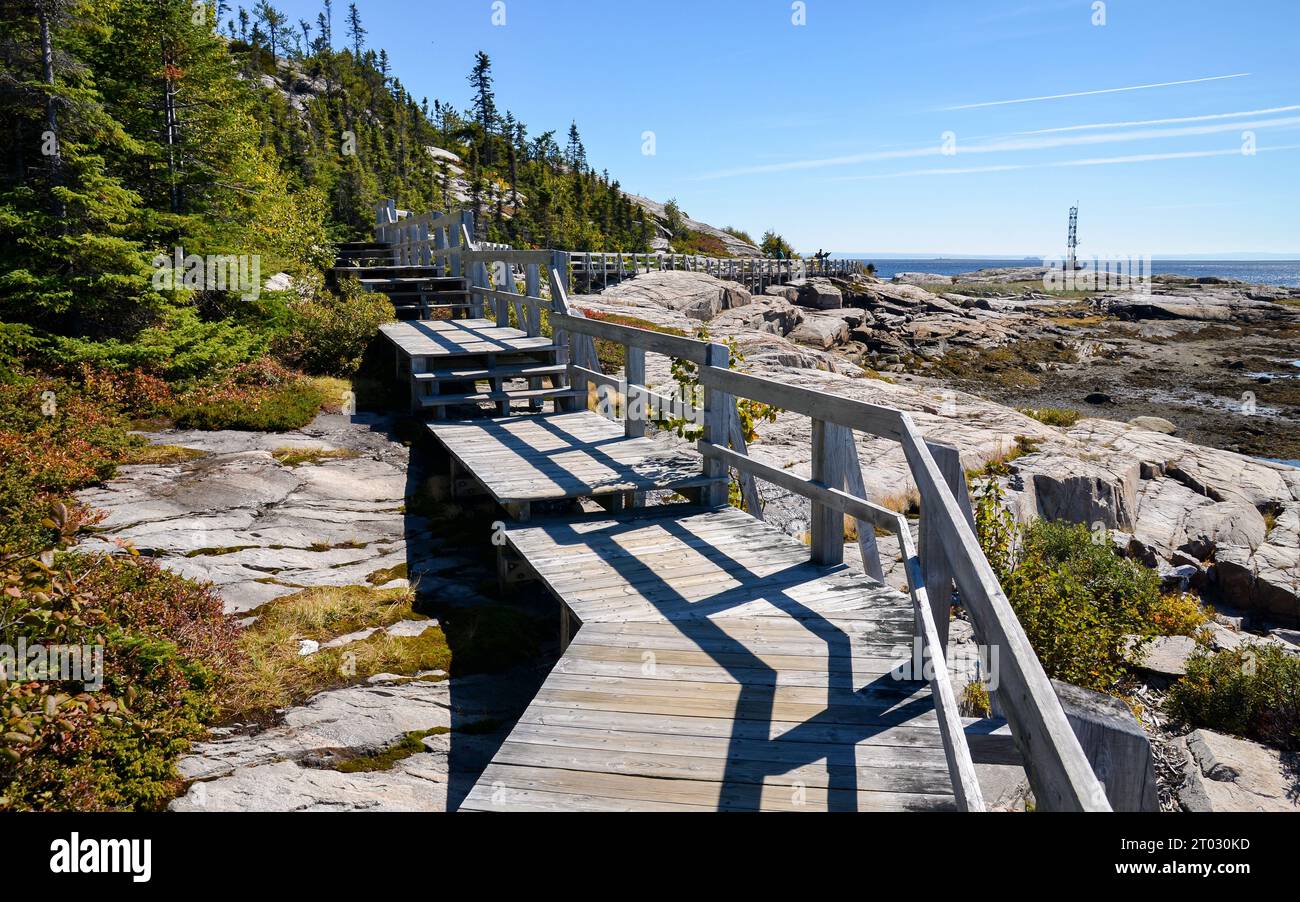 Wooden pathway along the Saguenay River in the bay of Tadoussac, Quebec ...