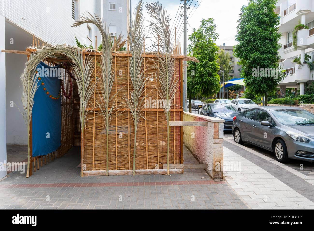 Rishon Lezion, Israel - October 01, 2023:Sukkah on the street near a ...