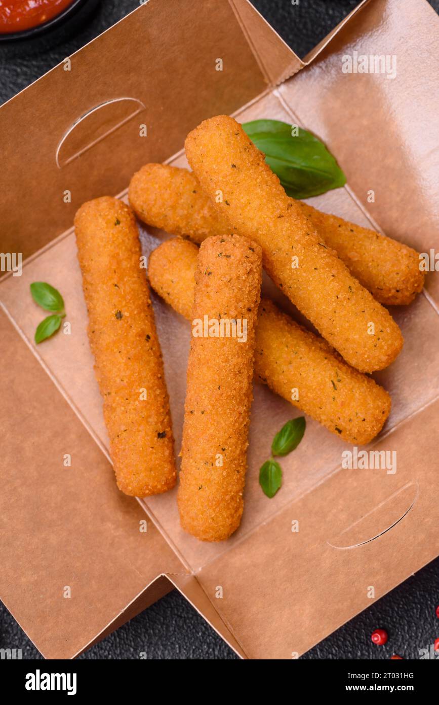Delicious crispy cheese sticks with mozzarella, salt and spices ...