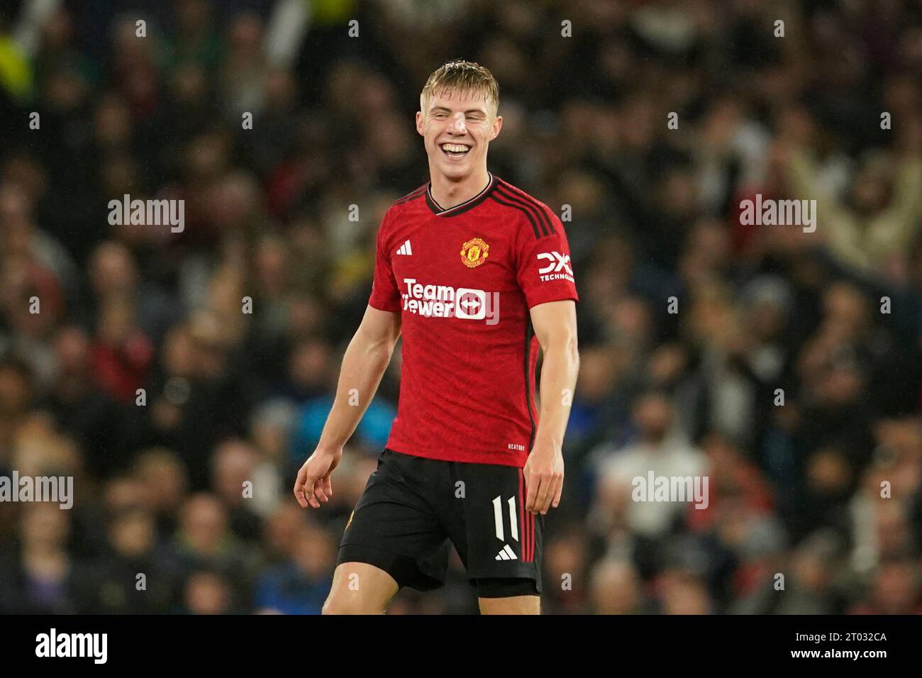 Manchester United's Rasmus Hojlund, left, smiles after scoring his side's second goal during the ...