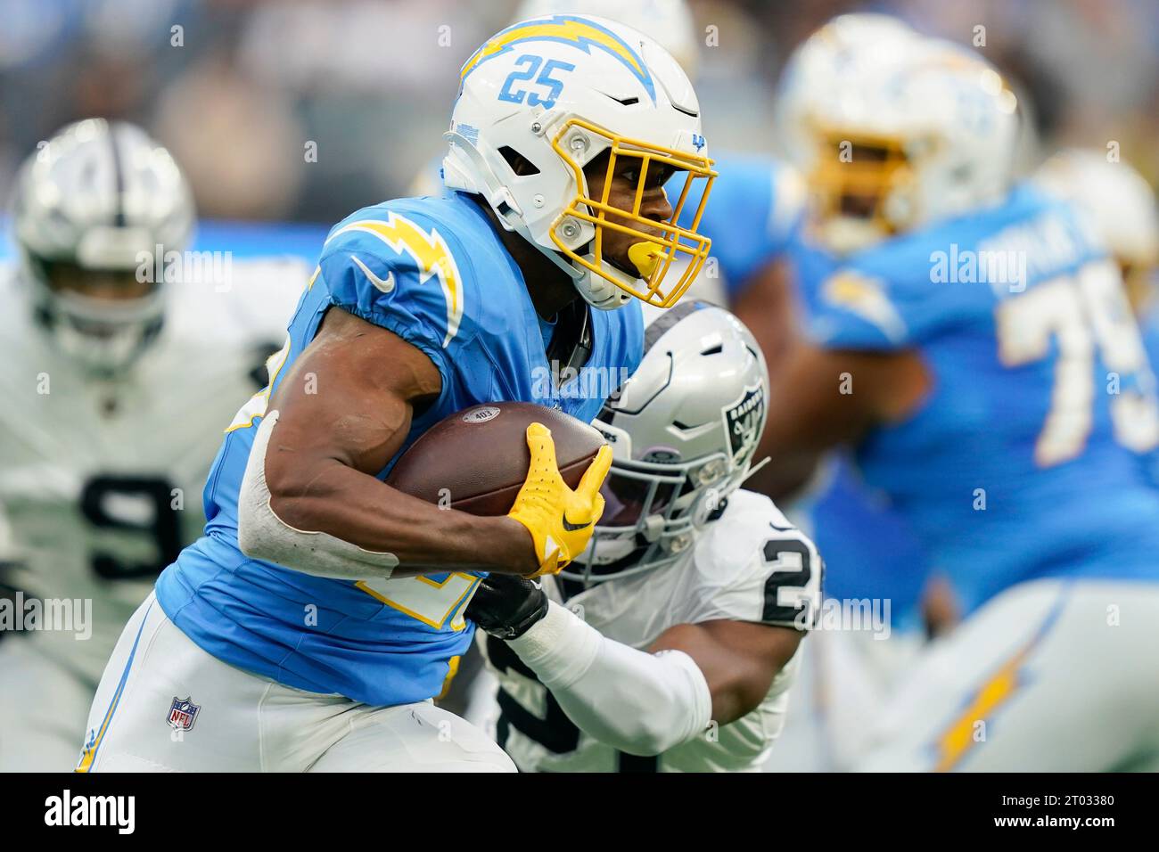 Los Angeles Chargers running back Joshua Kelley is tackled by Las Vegas ...