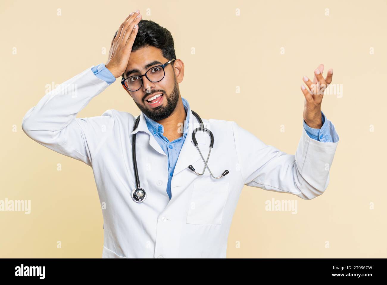 Indian young doctor cardiologist man feeling hopelessness and ...