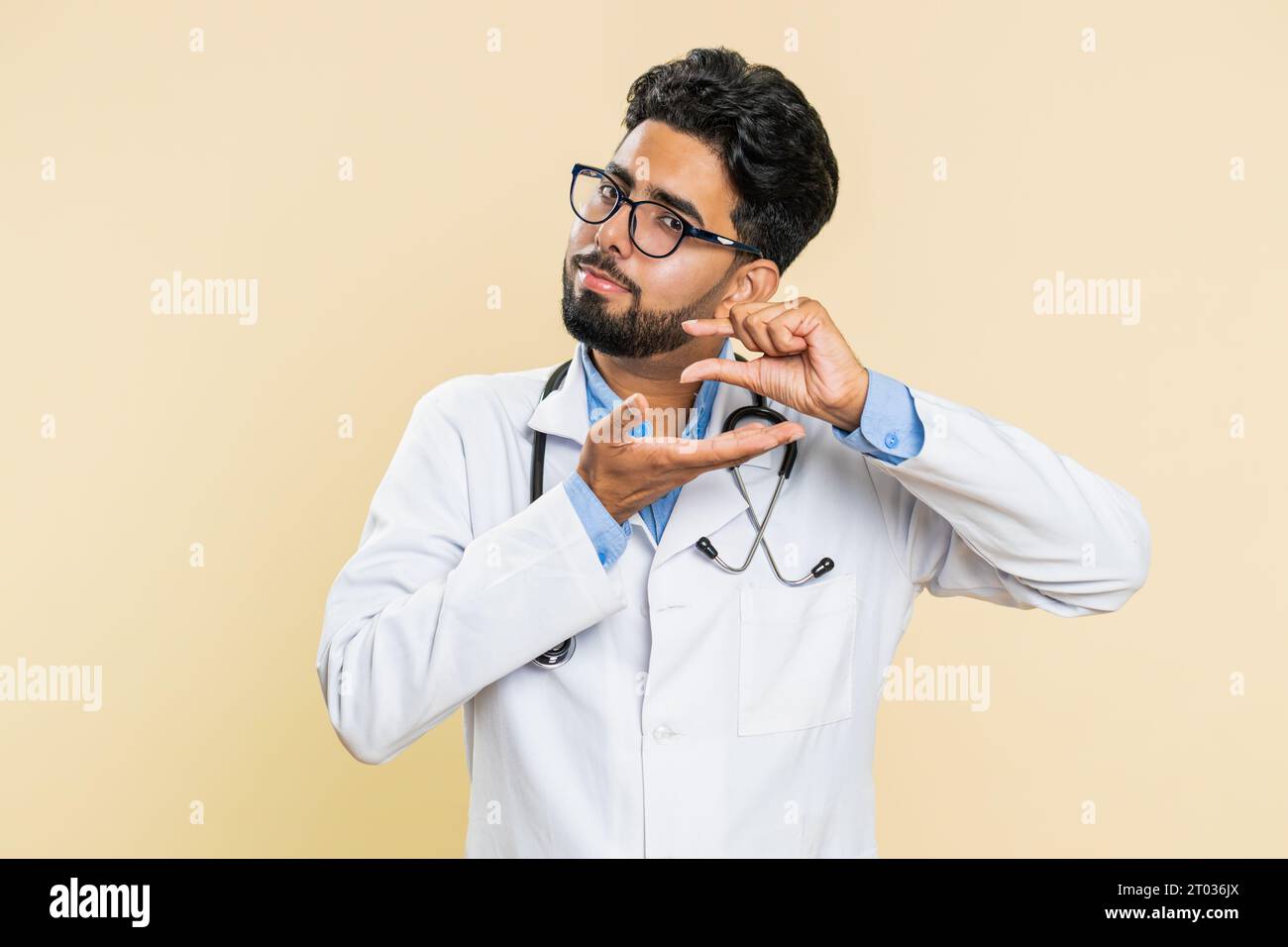 Need some more, please give me. Indian young doctor cardiologist man ...