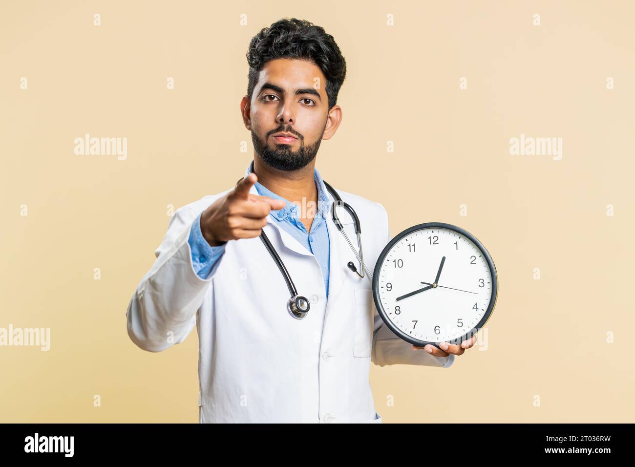 It is your time to heal. Indian young doctor cardiologist man showing ...