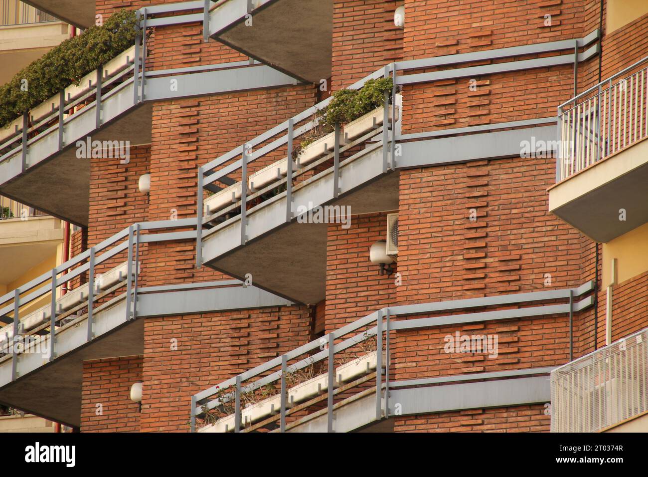 The exterior of a red brick residential building in Barcelona, Spain ...