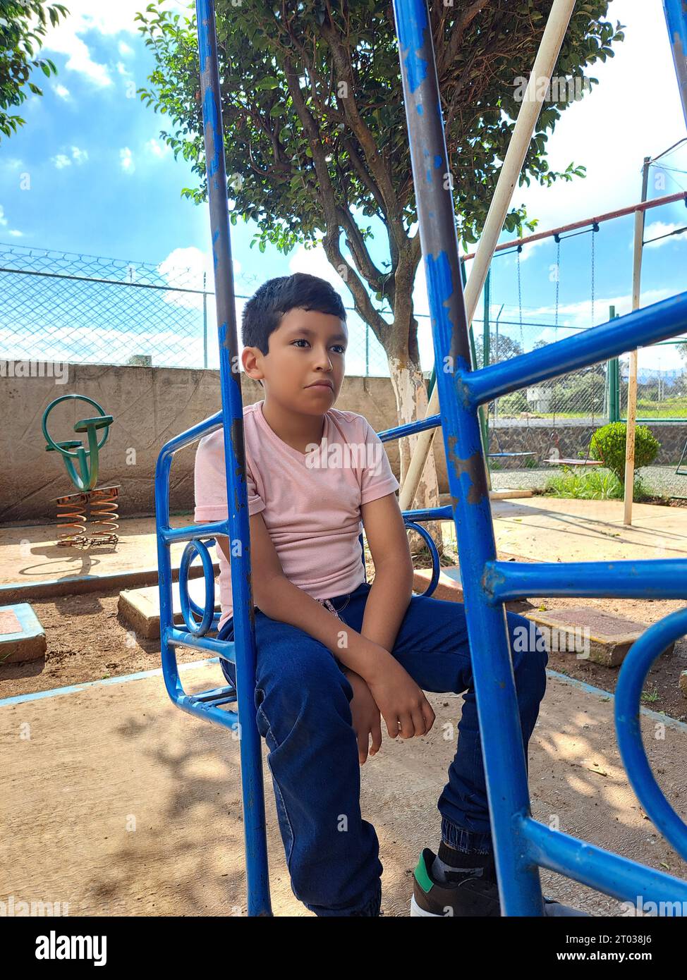 9-year-old dark-skinned Latin boy is sad in the games, suffers from his ...