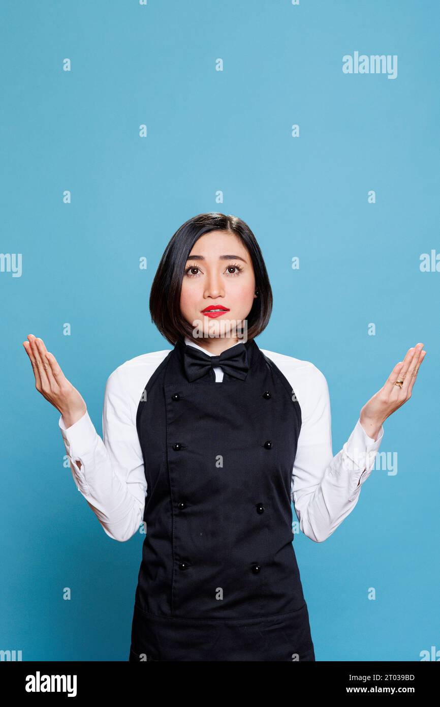 Restaurant young asian woman employee praying with open arms and ...
