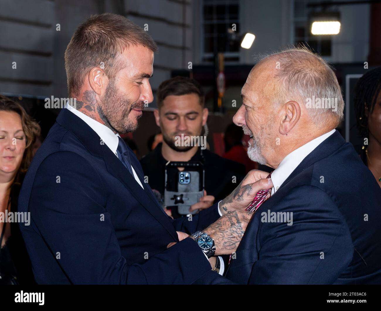 David Beckham, left, adjusts Ted Beckham's tie upon arrival at the ...