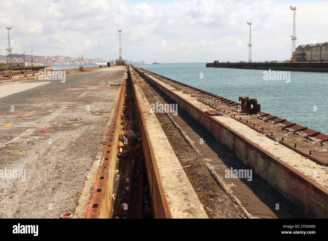 An elevated train track running through a body of water with a bridge ...