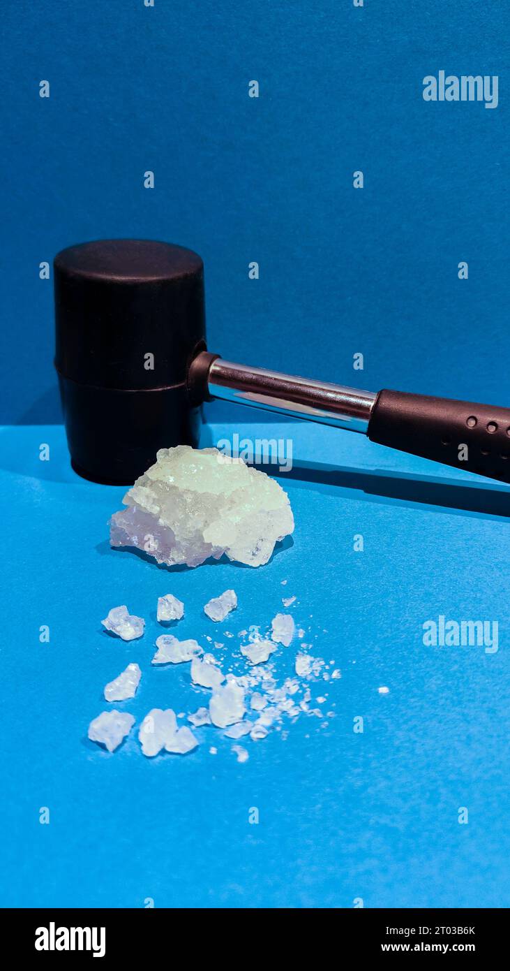 vertical photo of a sodium chloride mineral or common salt hit with a ...