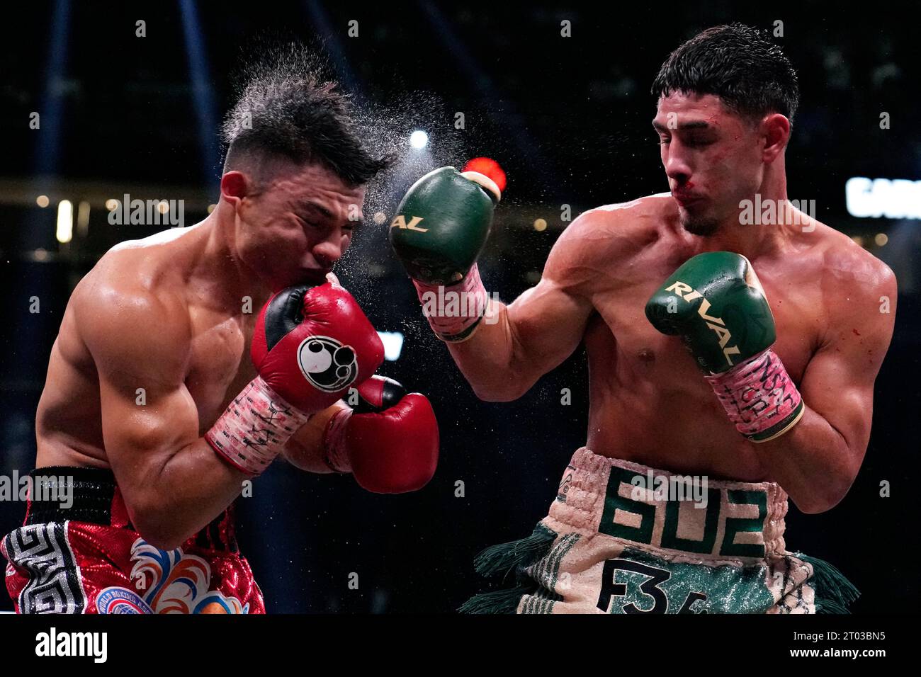 Elijah Garcia, right, lands a right to Armando Resendiz during their ...