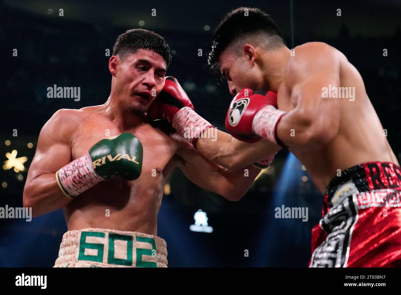 Armando Resendiz, right, hits Elijah Garcia during their middleweight ...