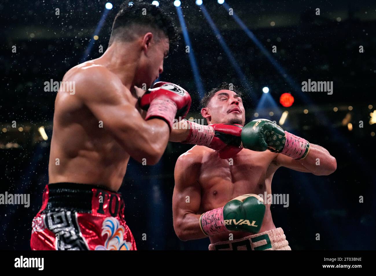 Armando Resendiz hits Elijah Garcia during their middleweight boxing ...