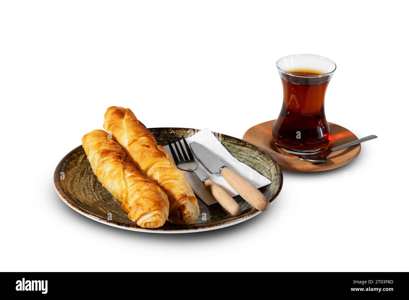 A comforting Turkish snack: two slices of borek with a glass of Turkish ...