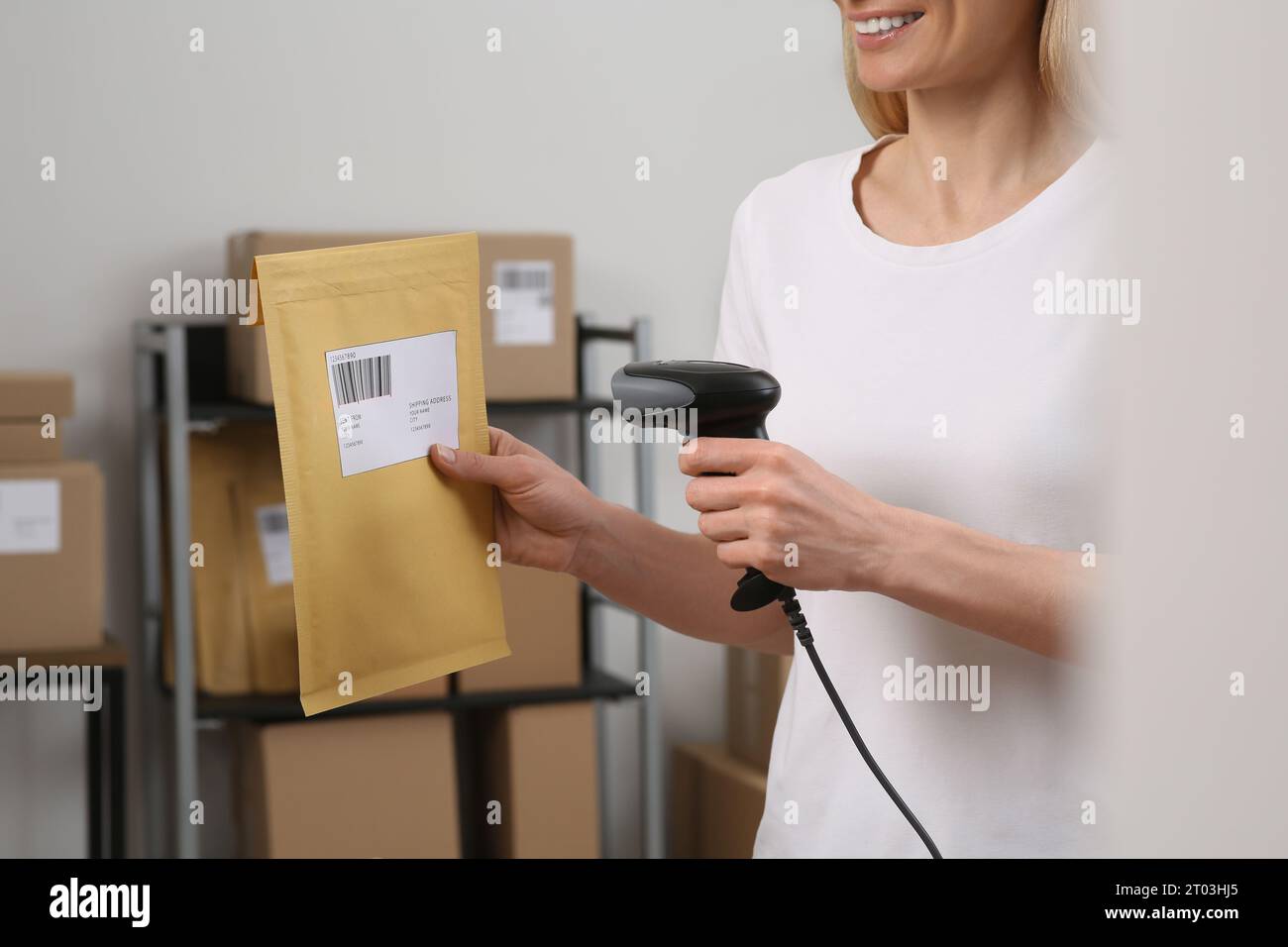 Woman scanner reading parcel hi-res stock photography and images - Alamy