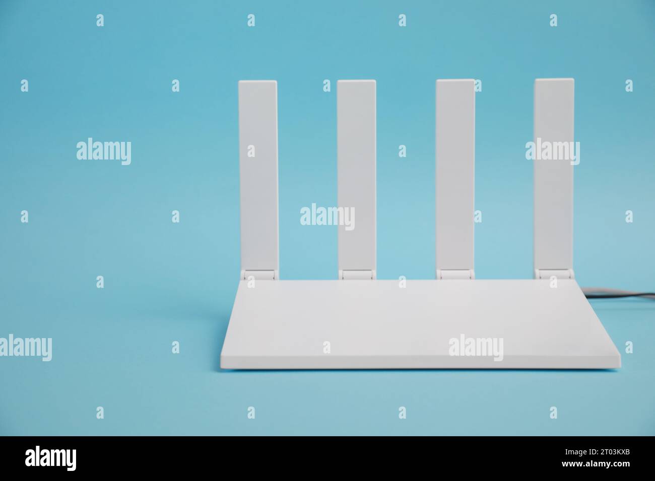 Modern Wi-Fi router on light blue background. Space for text Stock ...