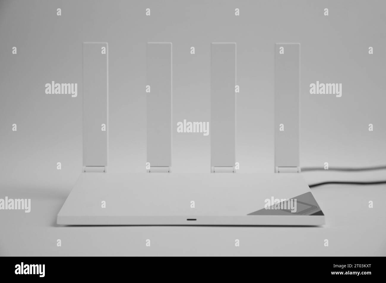 Modern Wi-Fi router on light grey background Stock Photo - Alamy