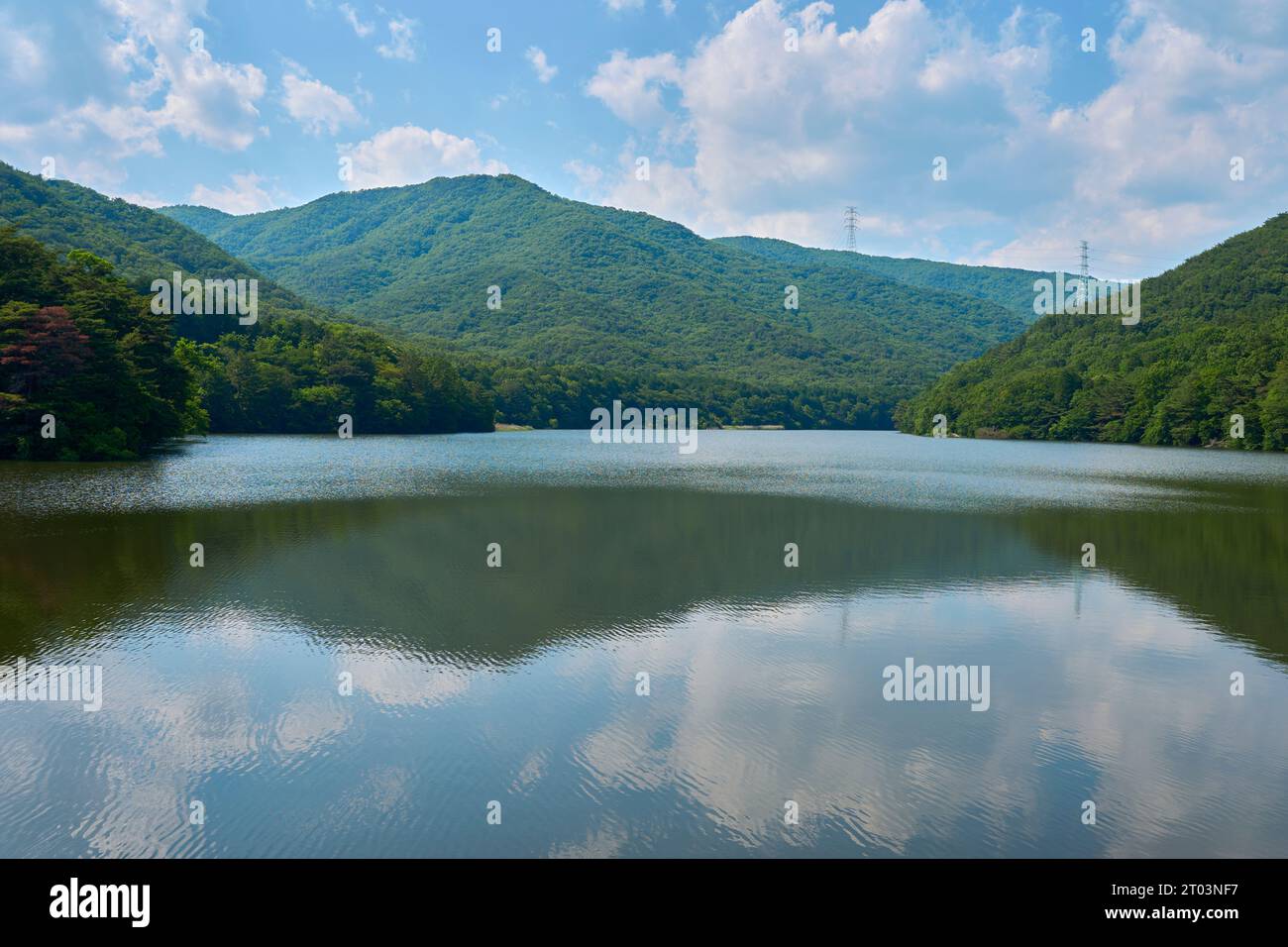 Peaceful lake surrounded mountains hi-res stock photography and images ...