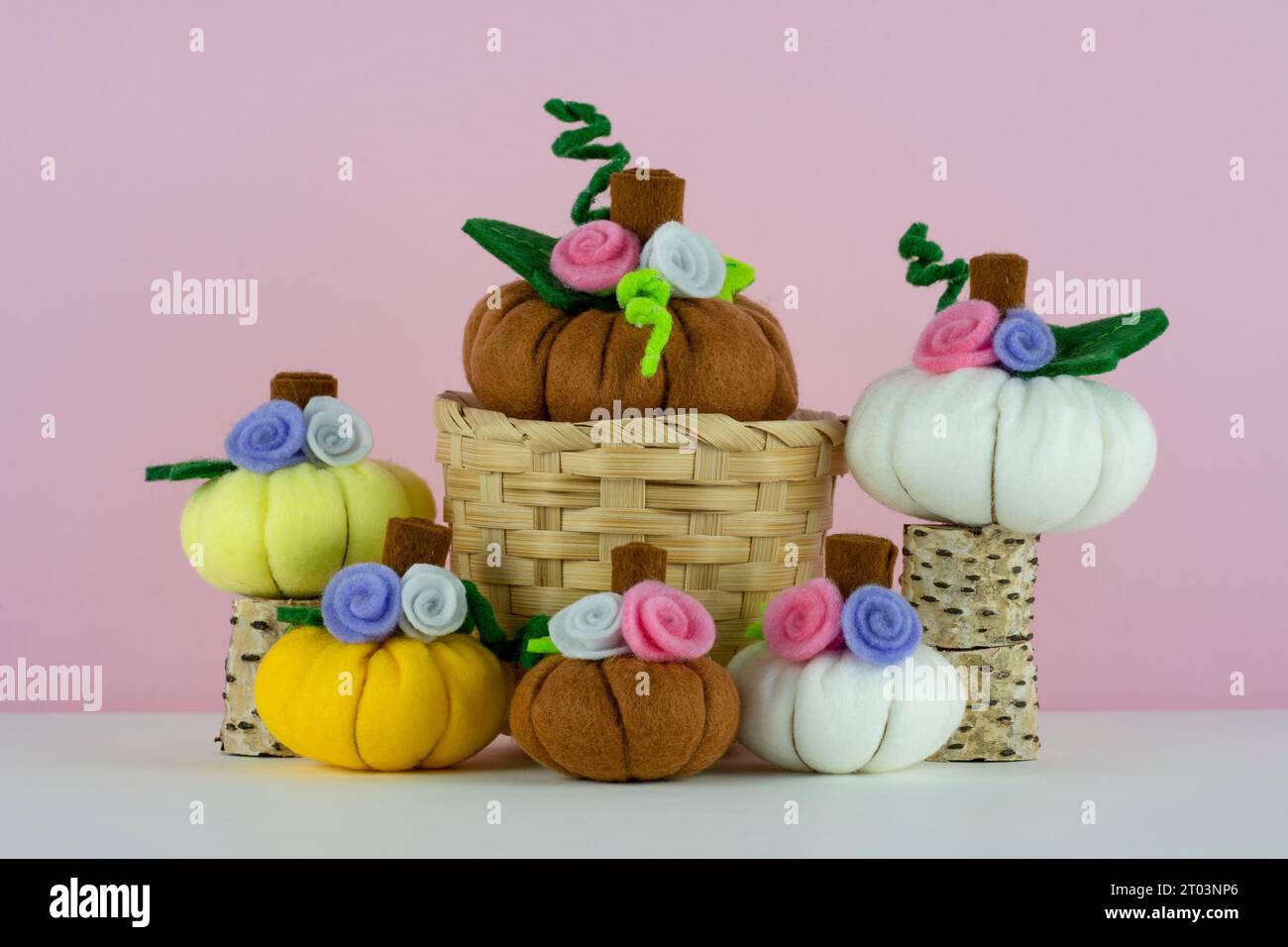 Handmade cute pumpkins made from felt on pink background Stock Photo ...