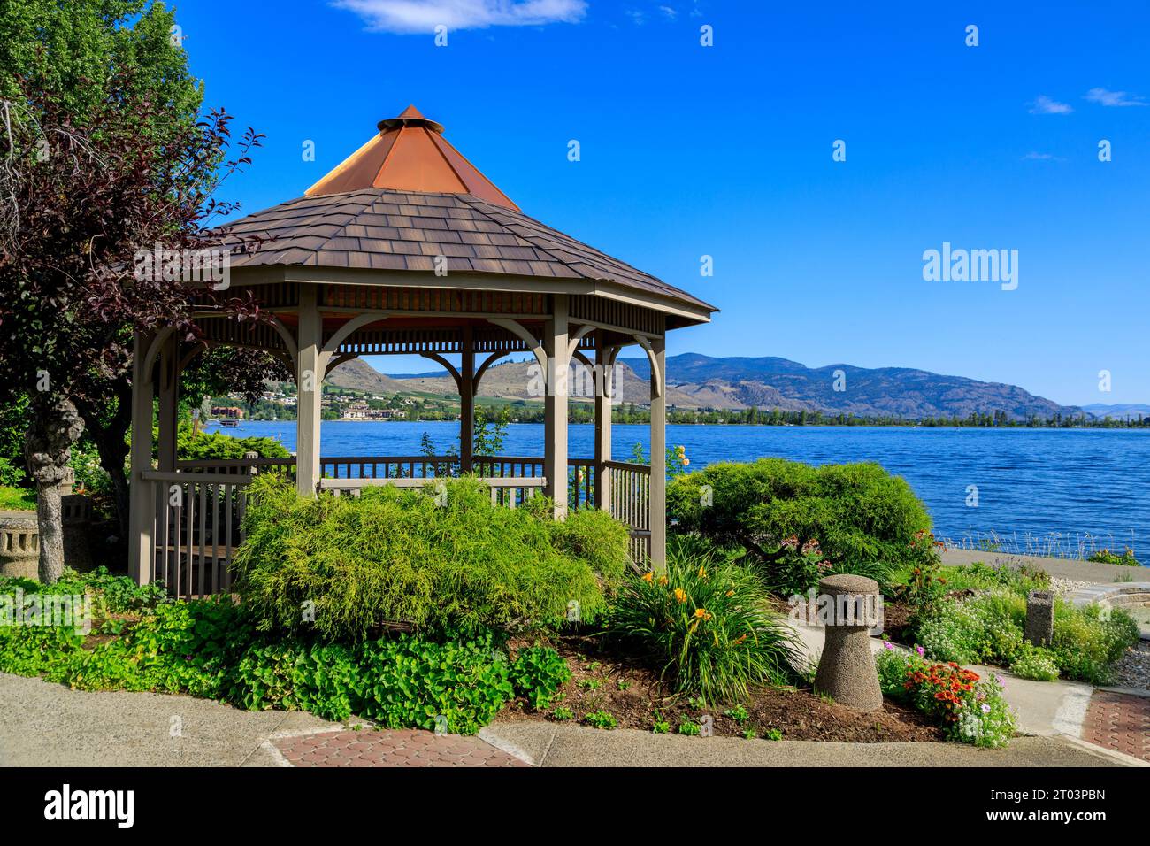 Wooden gazebo in a garden park on the waterfront of Osoyoos Lake ...