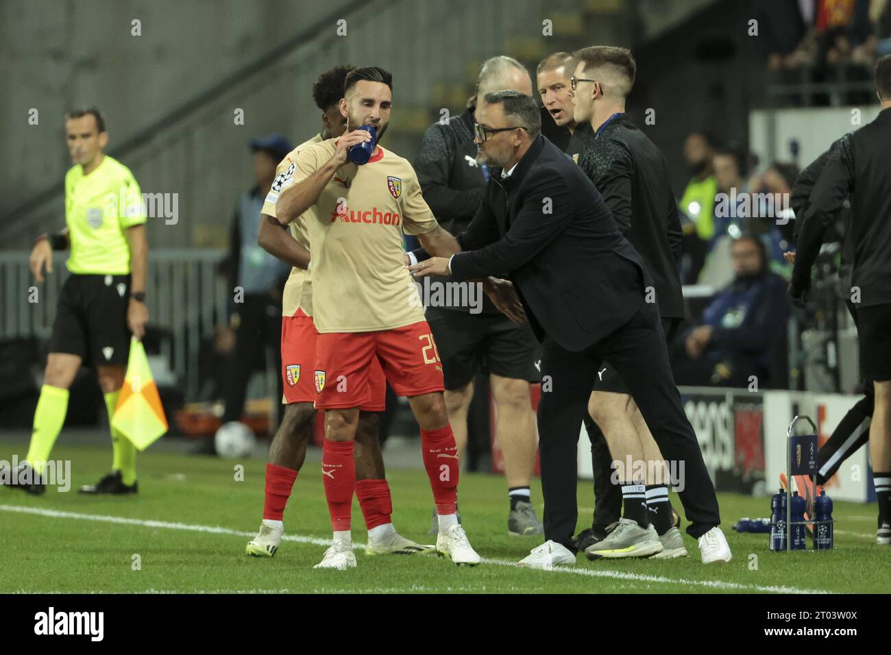 Adrien Thomasson of Lens celebrates his goal with Coach of RC Lens ...