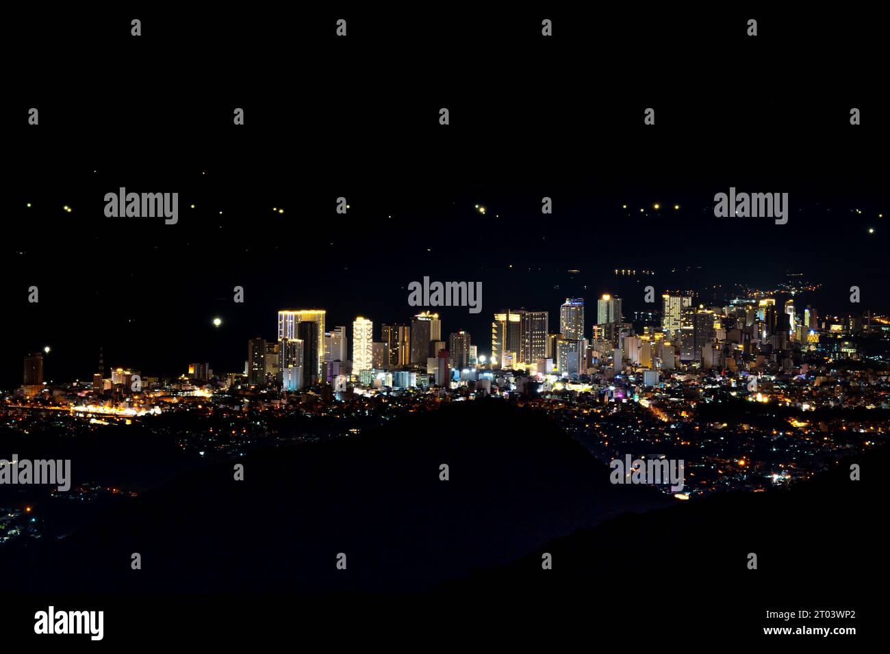 Panorama of the coastal city of Nha Trang, Vietnam at night. View from ...