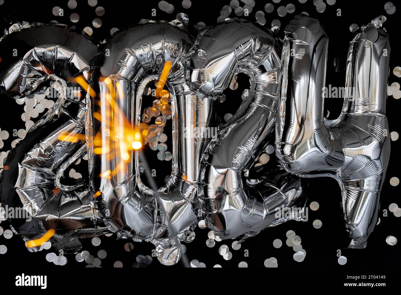 Happy new year 2024 metallic balloons with confetti and sparkler ...