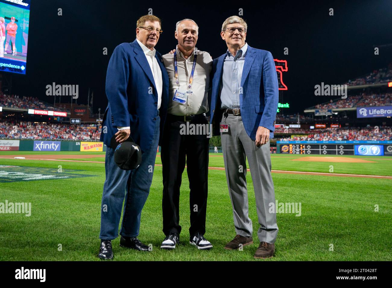 MLB Commissioner Rob Manfred, center, poses with Miami Marlins owner ...