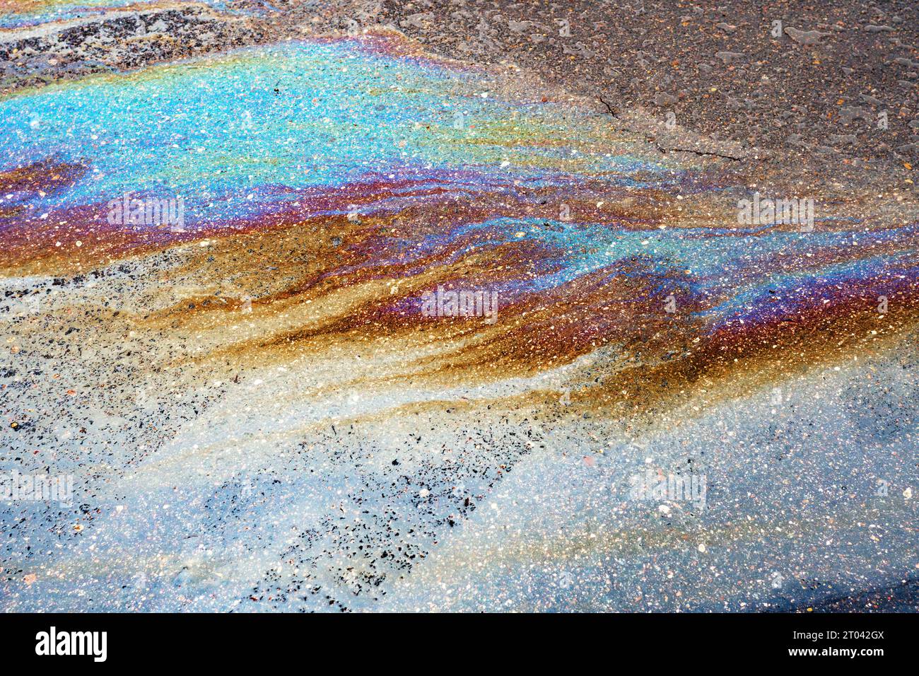 Texture of colorful petrol oil spill on wet pavement. Slick industry ...