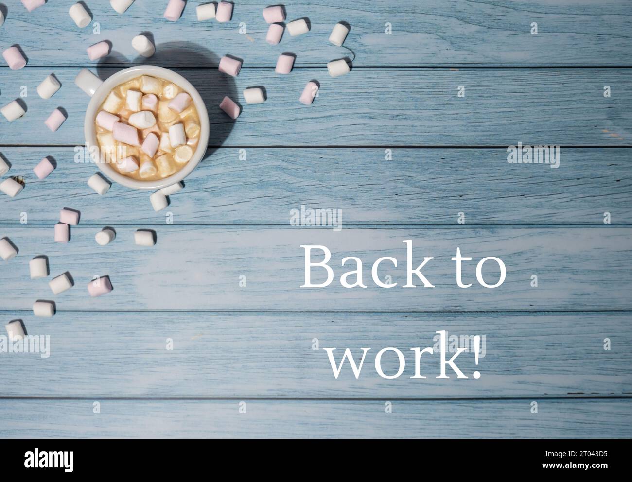 BACK TO WORK concept text with white cup of coffee and marshmallows on ...
