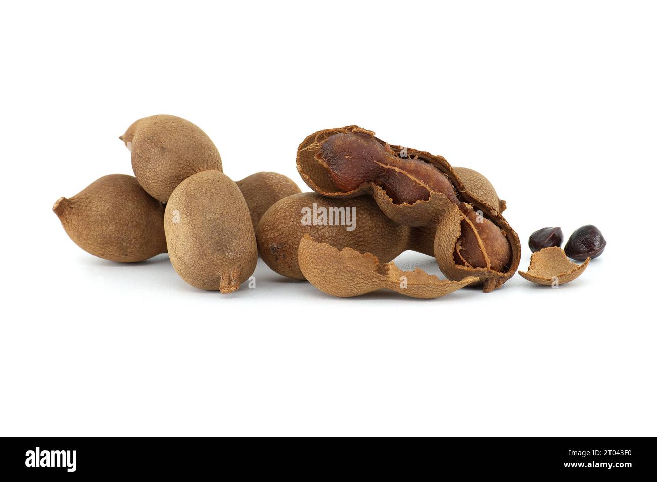 Tamarind fruits, whole and cracked open isolated on white background ...