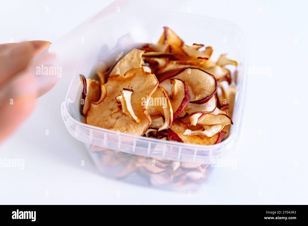 storing apple chips in an eco-plastic box Stock Photo - Alamy