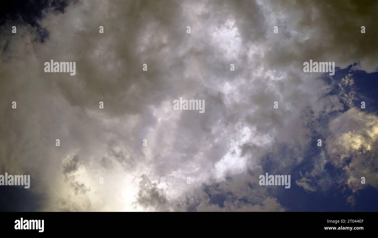 Ornamental clouds. Dramatic sky. Epic storm cloudscape. Soft sunlight ...