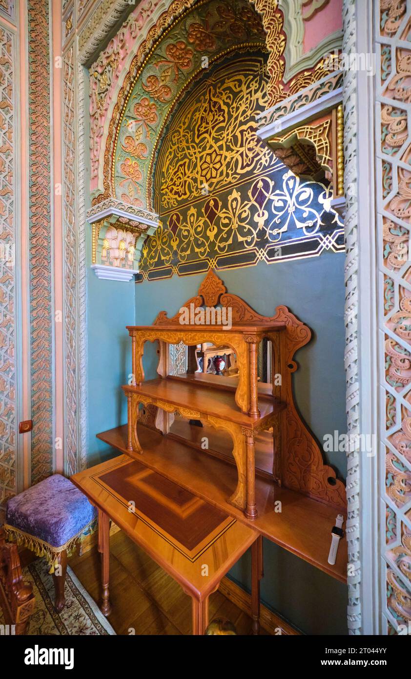 View of an ornate, carved wood desk, display table. At the mansion of ...