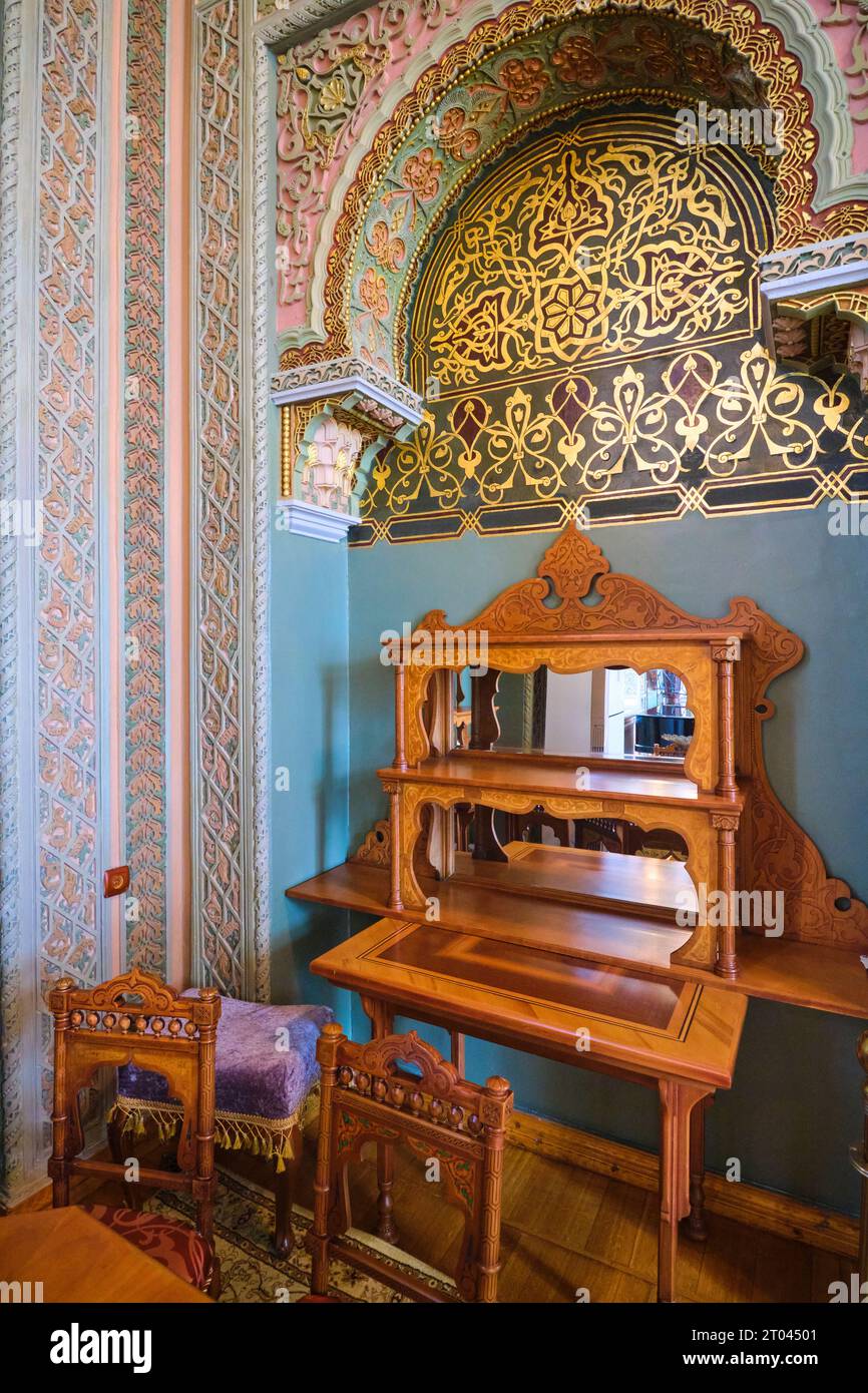 View of an ornate, carved wood desk, display table. At the mansion of ...
