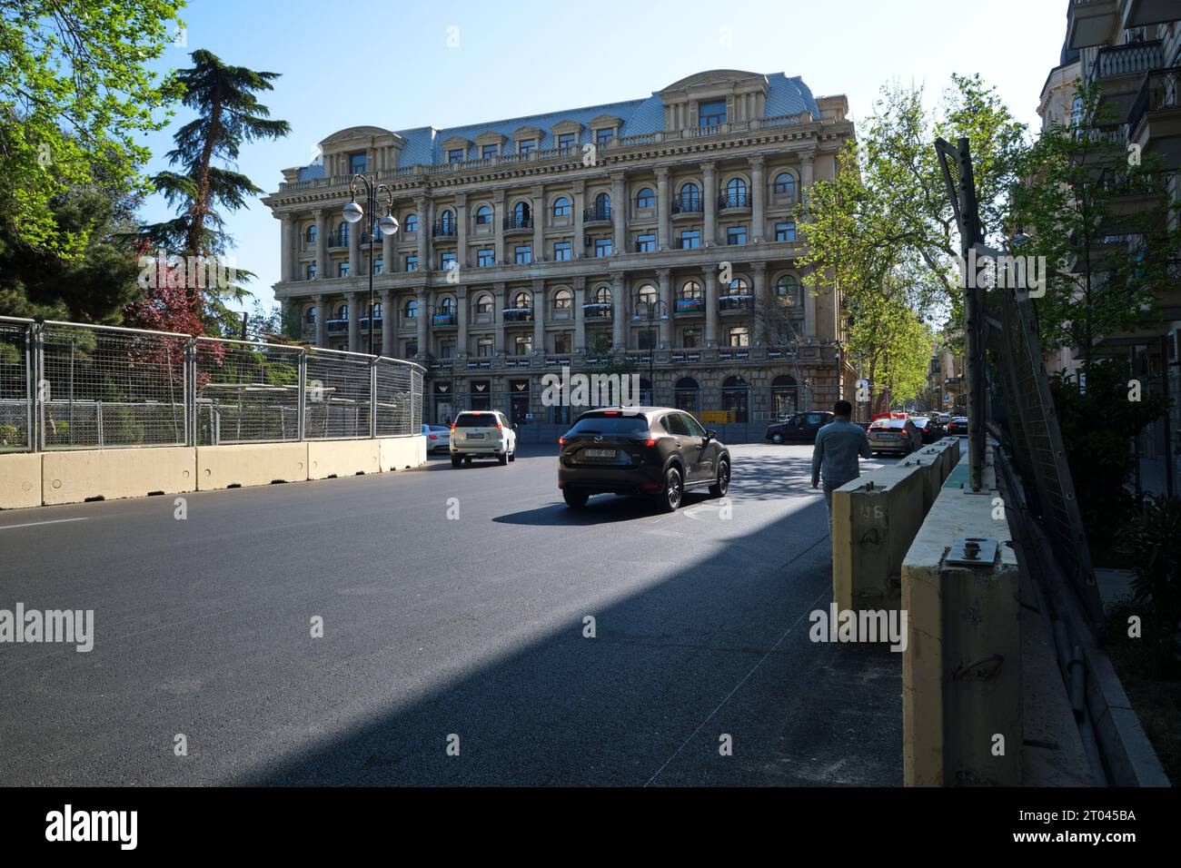 Regular cars, traffic on the course, days before the big race. At the ...