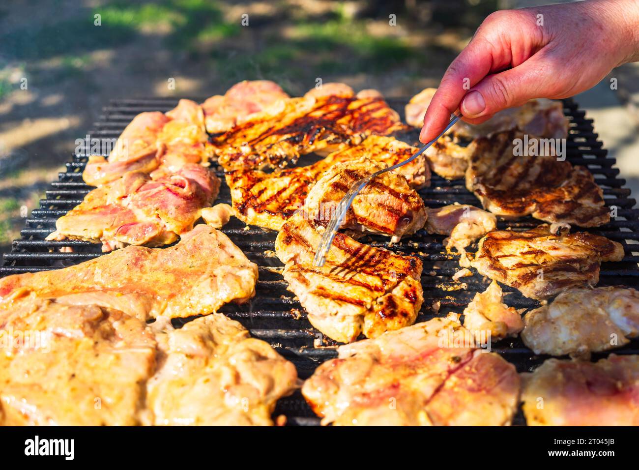 Raw steak on a charcoal barbeque. Top view of camping tasty barbecue ...