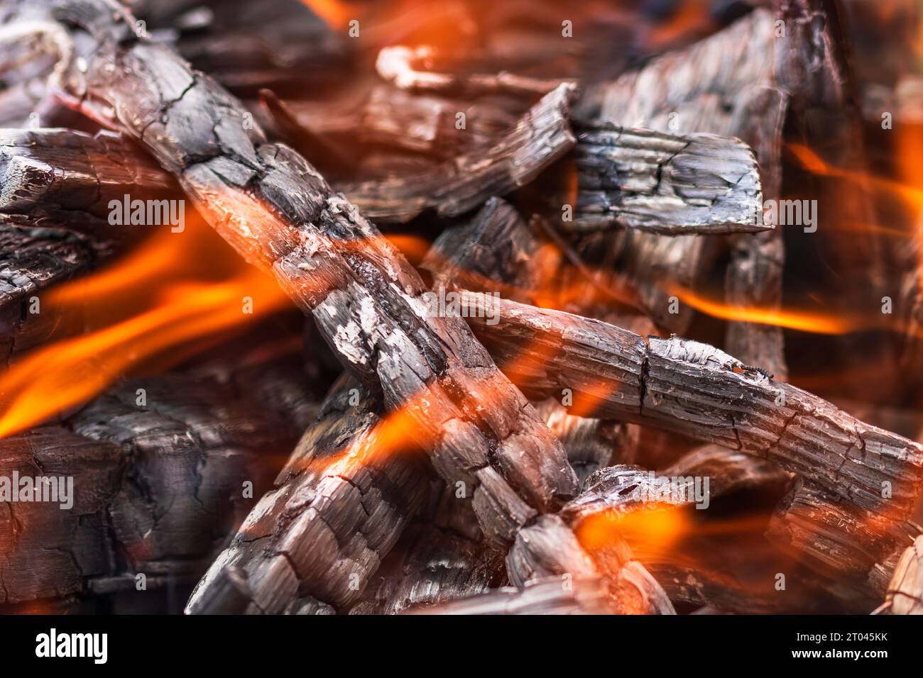 Burning wood chips forming coal. Barbecue preparation, fire before ...