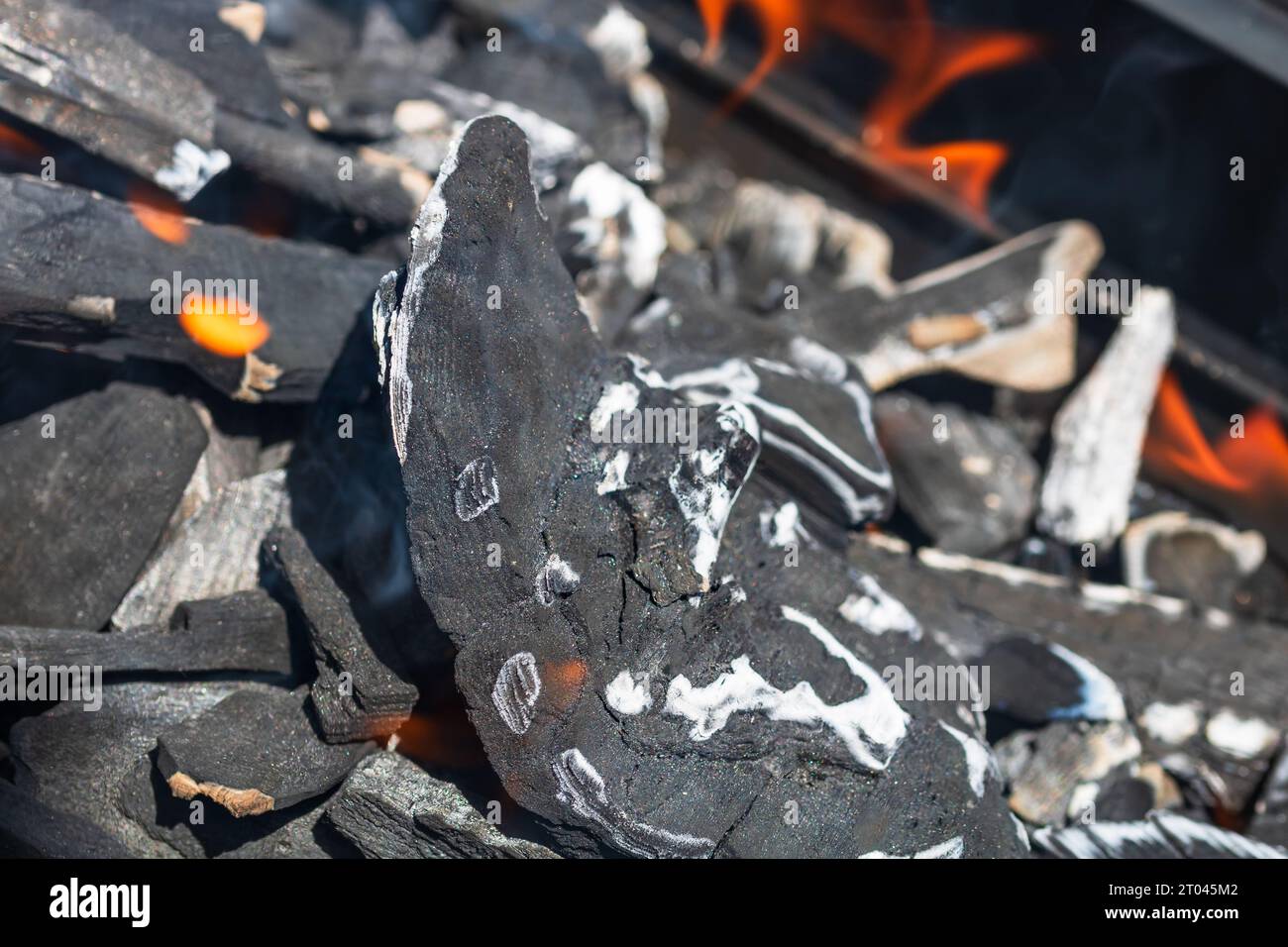 Barbecue grill pit with glowing and flaming hot open fire with red ...