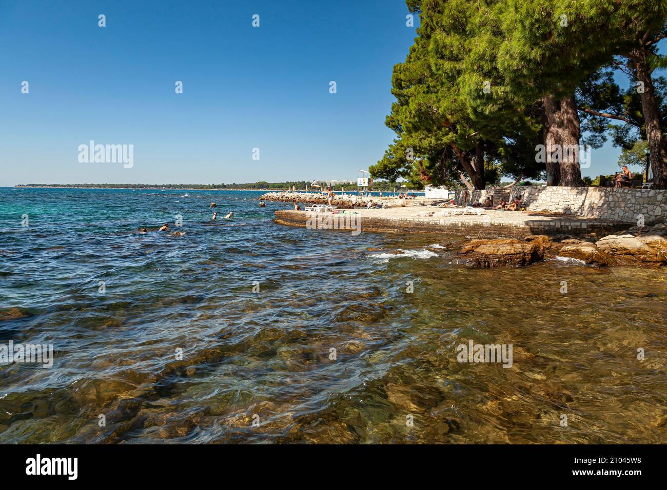 Beach on the stone coast of Spadici, Porec, Istria, Croatia Stock Photo ...