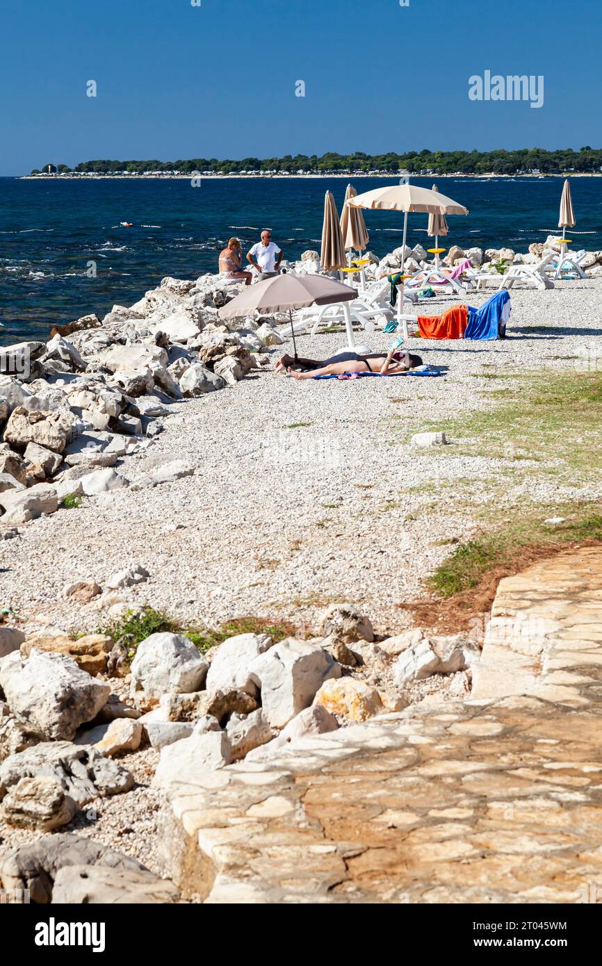 Beach on the stone coast of Spadici, Porec, Istria, Croatia Stock Photo ...