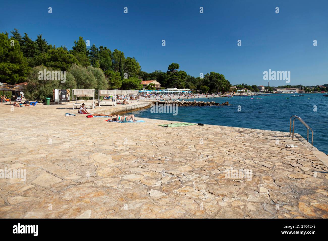 Beach on the stone coast of Spadici, Porec, Istria, Croatia Stock Photo ...